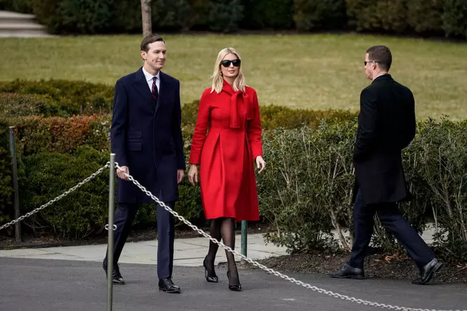 Ivanka Trump lost, put on a red coat of an unusual cut